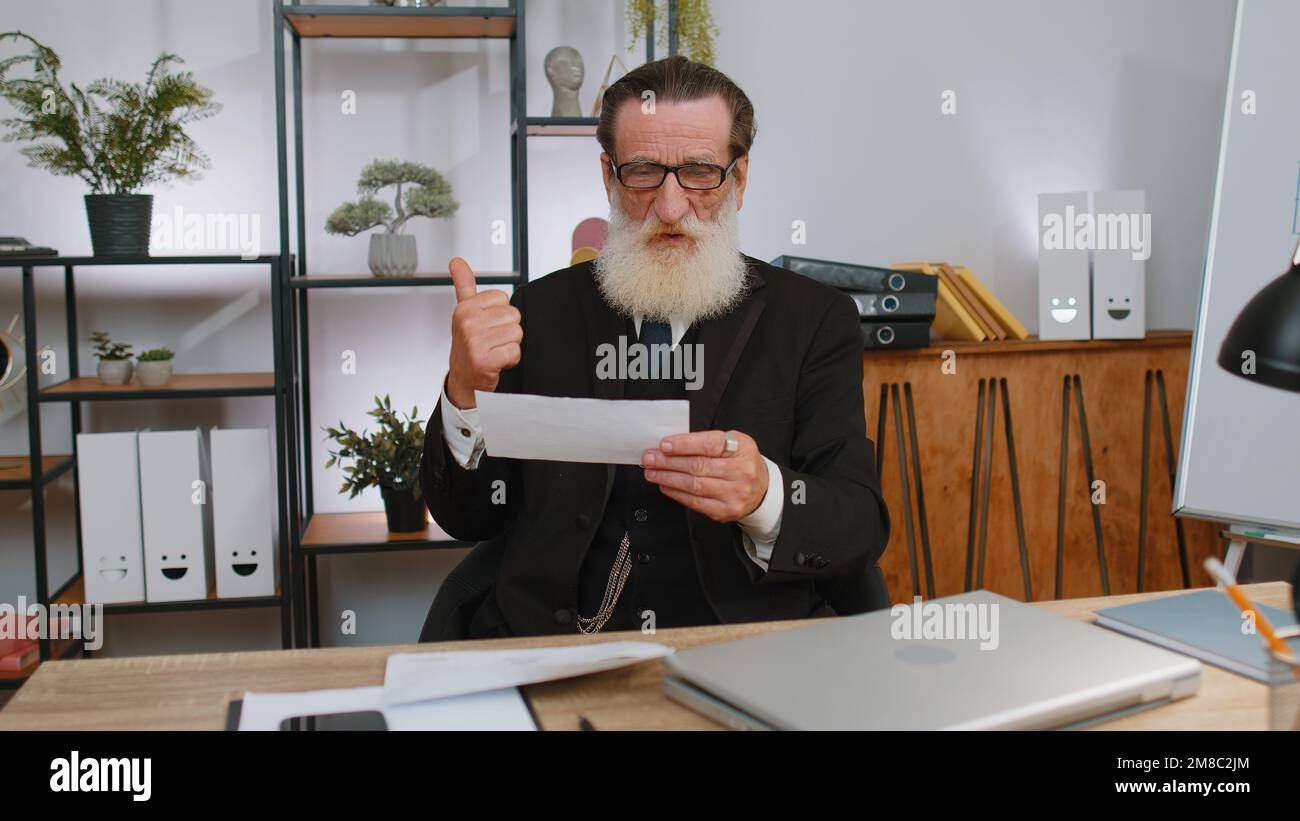 Senior business man open envelope letter, reading it. Career growth ...
