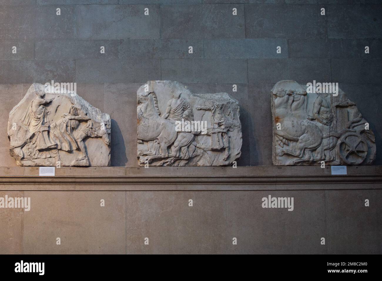 Visitors view the Parthenon Marbles, also known as the Elgin Marbles, at the British Museum in ...
