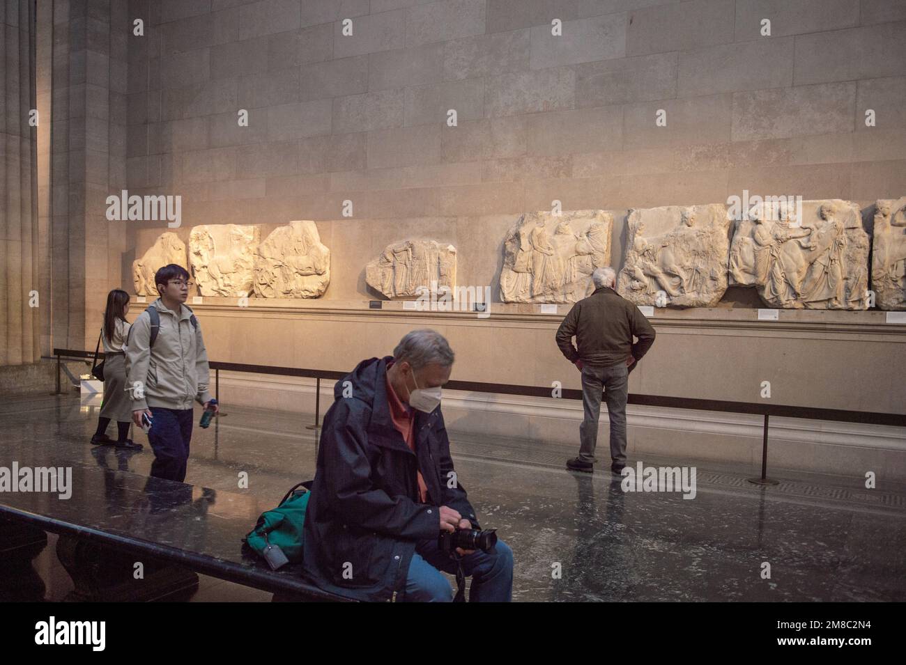 Visitors view the Parthenon Marbles, also known as the Elgin Marbles, at the British Museum in ...