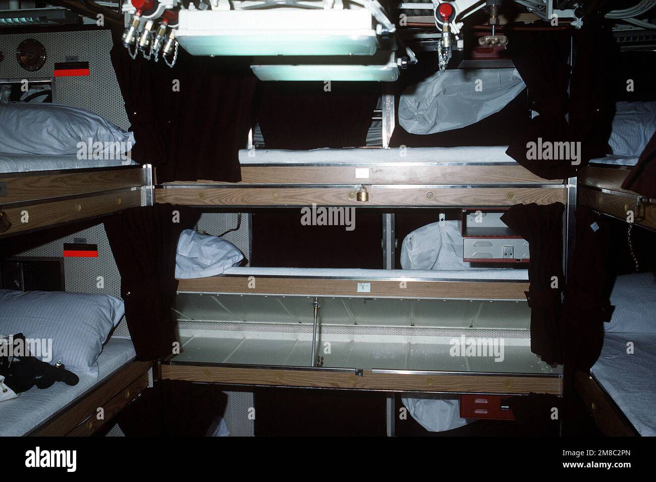 A view of an enlisted berthing area aboard the nuclear-powered ...