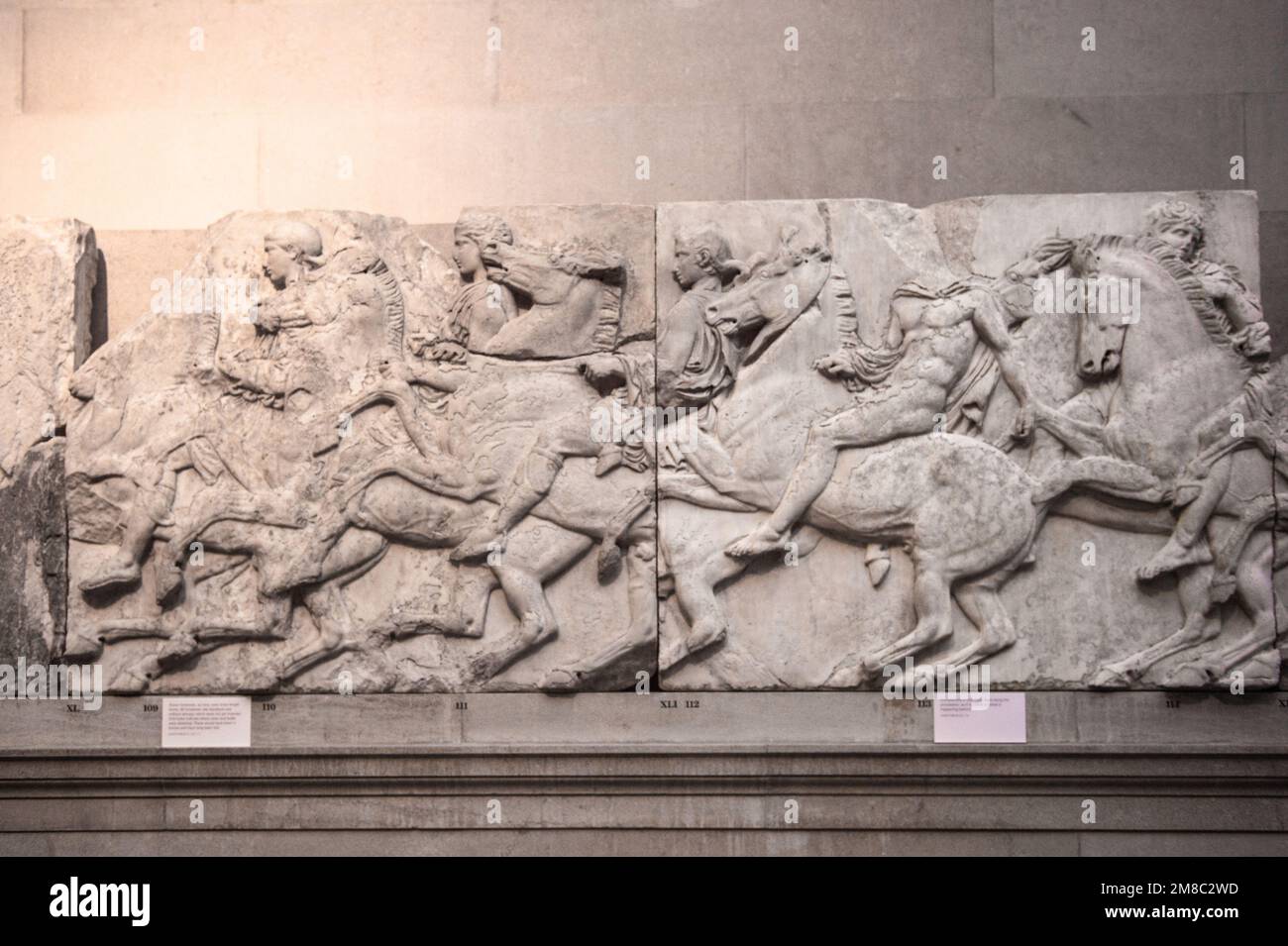 Visitors view the Parthenon Marbles, also known as the Elgin Marbles, at the British Museum in ...