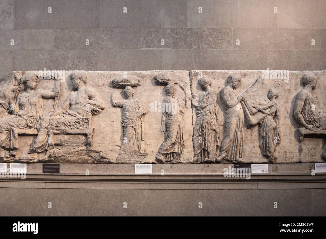 Visitors view the Parthenon Marbles, also known as the Elgin Marbles, at the British Museum in ...