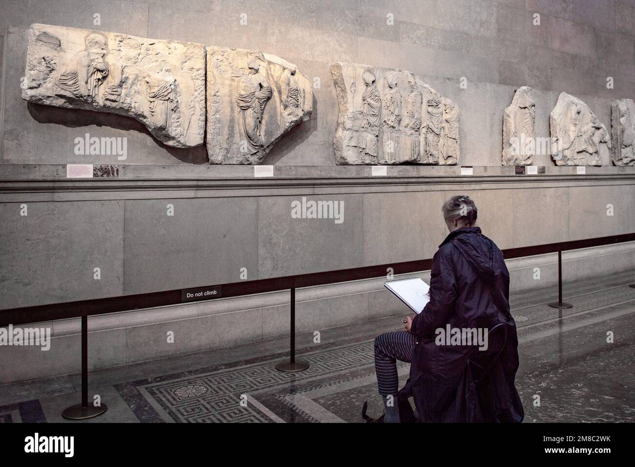 Visitors view the Parthenon Marbles, also known as the Elgin Marbles, at the British Museum in ...
