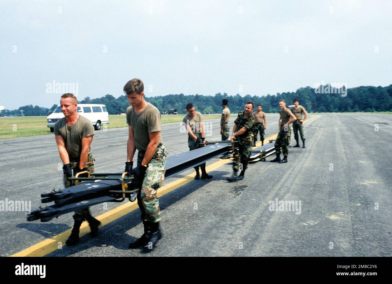 Soldiers from the 1ST Aviation Battalion, 82nd Airborne Division, carry ...
