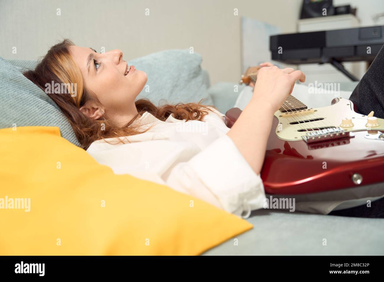 Inspired musician strumming new melody on stringed instrument Stock ...