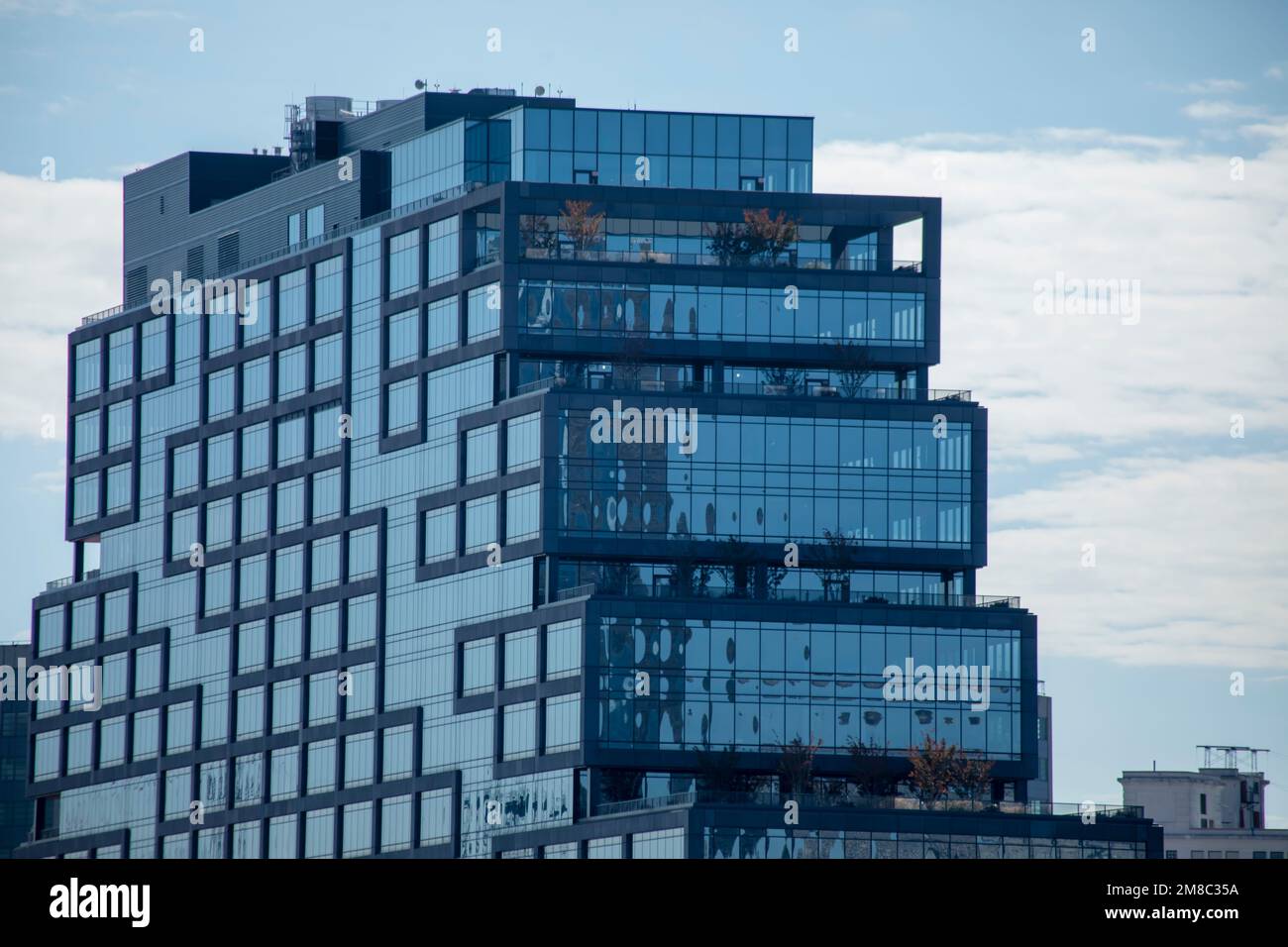 An abstract modern building with glass facade Stock Photo - Alamy