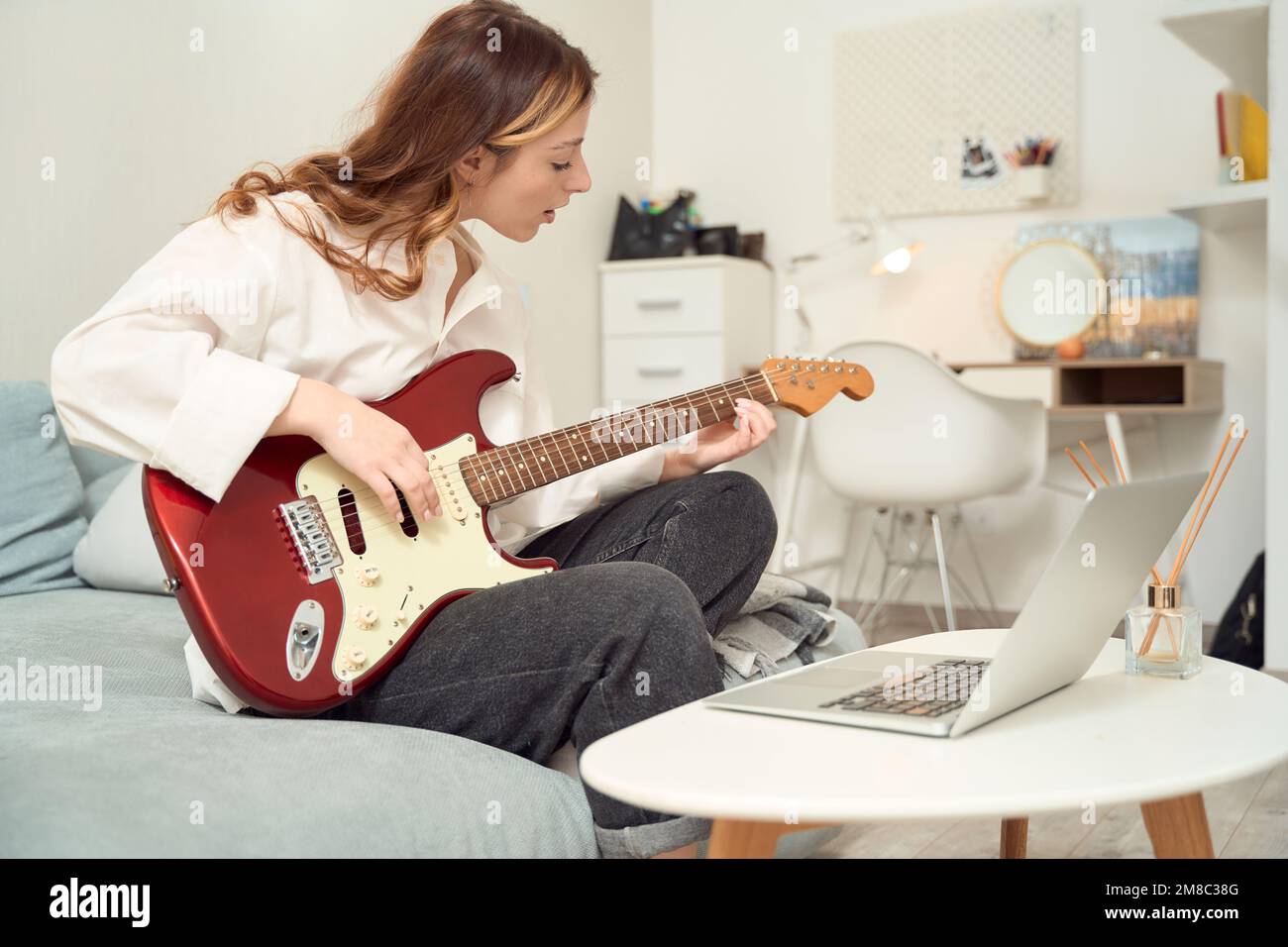 Play instrument modern home hi-res stock photography and images - Alamy