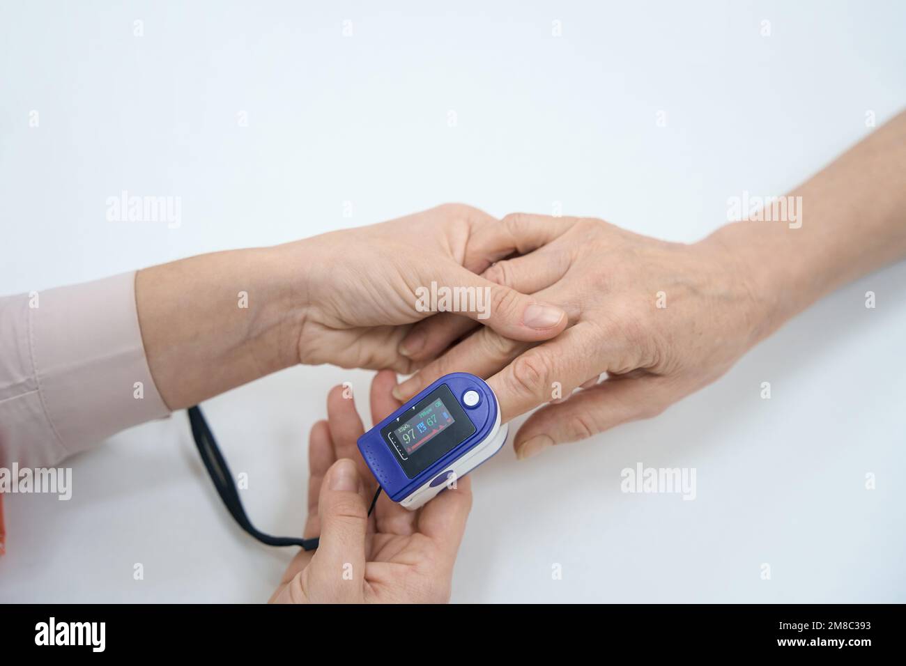 Nurse measures the level of oxygen in the patient blood Stock Photo - Alamy