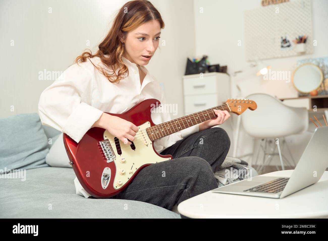 To play an instrument hi-res stock photography and images - Alamy