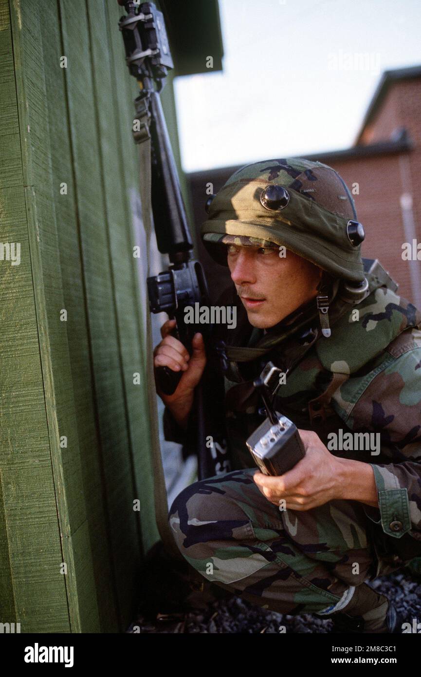 A member of the 509th Security Police Squadron monitors a hand-held ...