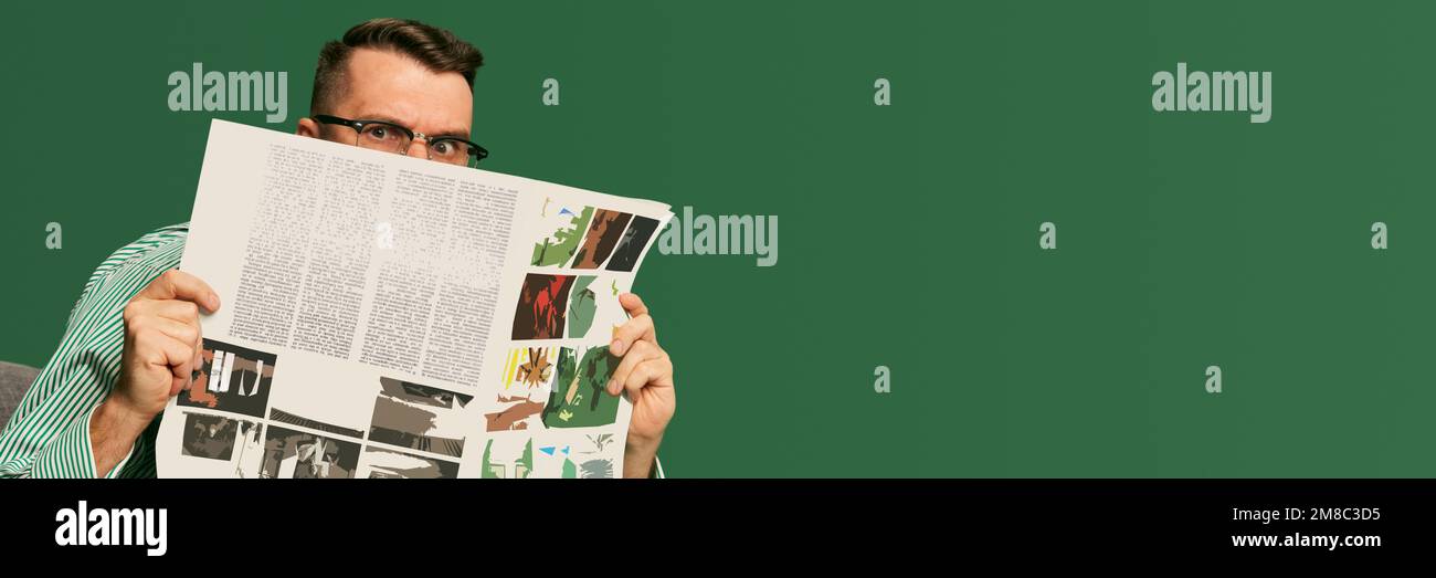 News. Portrait of man, businessman reading newspaper, posing over green ...