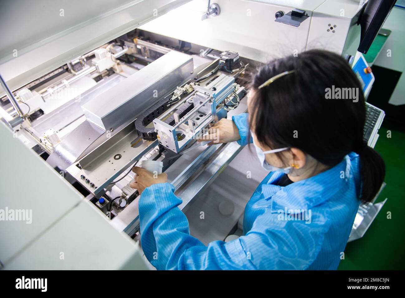 Changsha, China's Hunan Province. 13th Jan, 2023. A staff member makes circuit boards in a ...