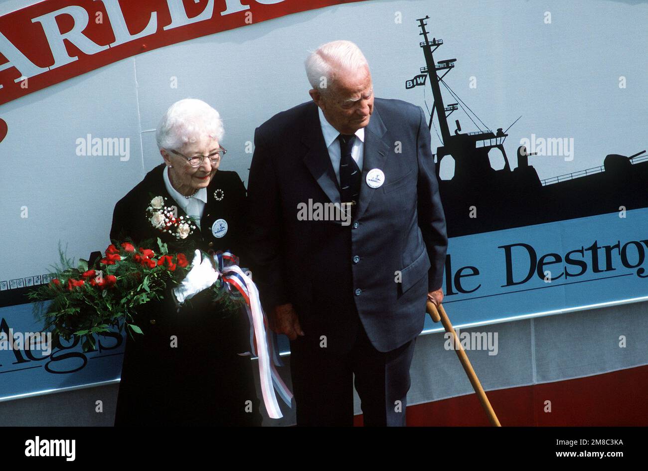 Retired Admiral Arleigh Burke and his wife Roberta stand in front of ...