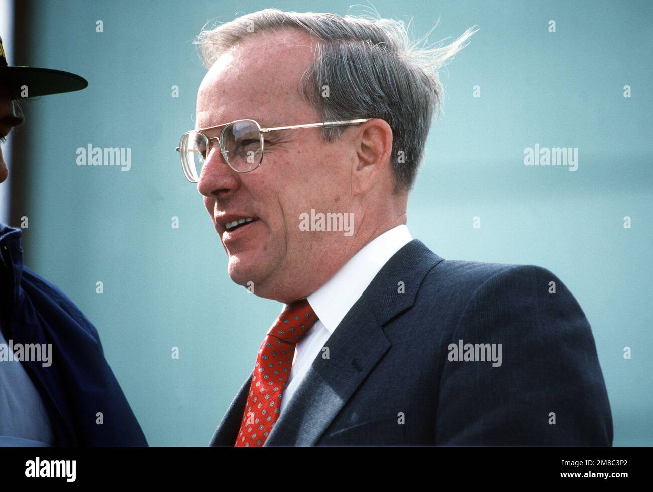 Secretary of the Navy H. Lawrence Garrett III speaks with a guest at ...