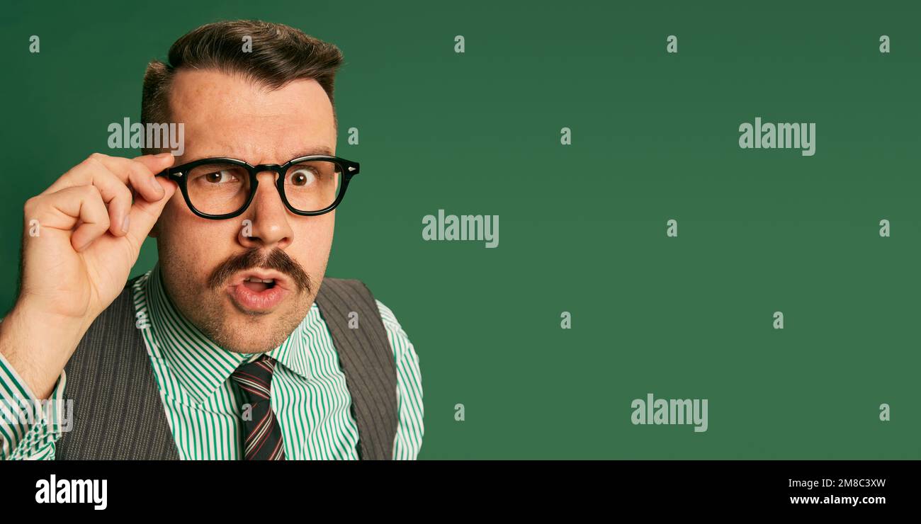 Questioning look. Portrait of handsome man, businessman in classical ...