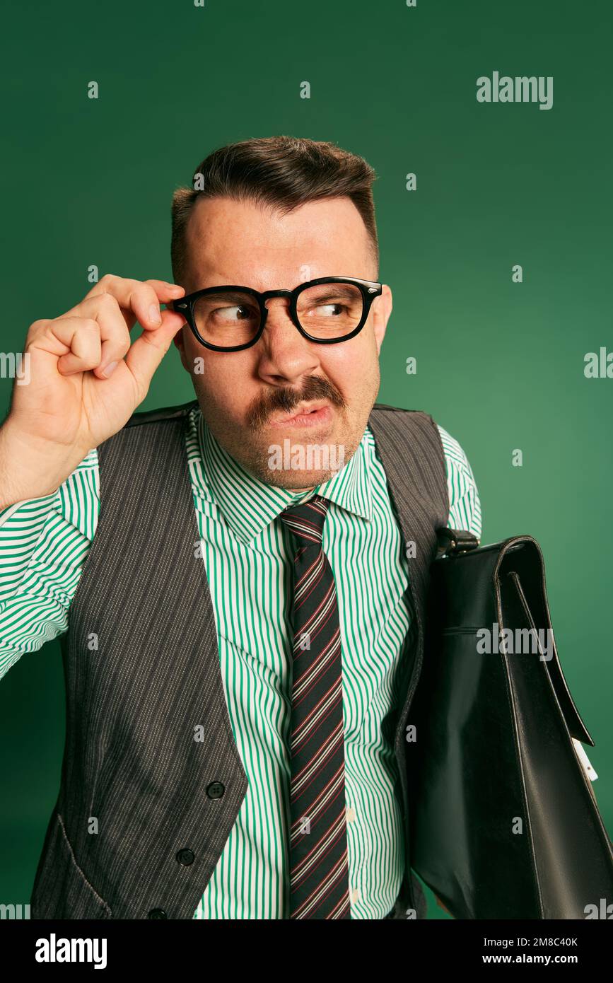 Curious, suspicious look. Portrait of emotive man, employee in ...