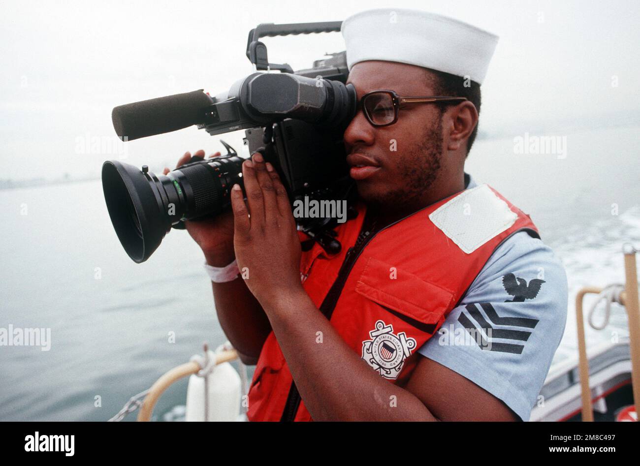 A Coast Guard video cameraman documents the departure of ships from San ...
