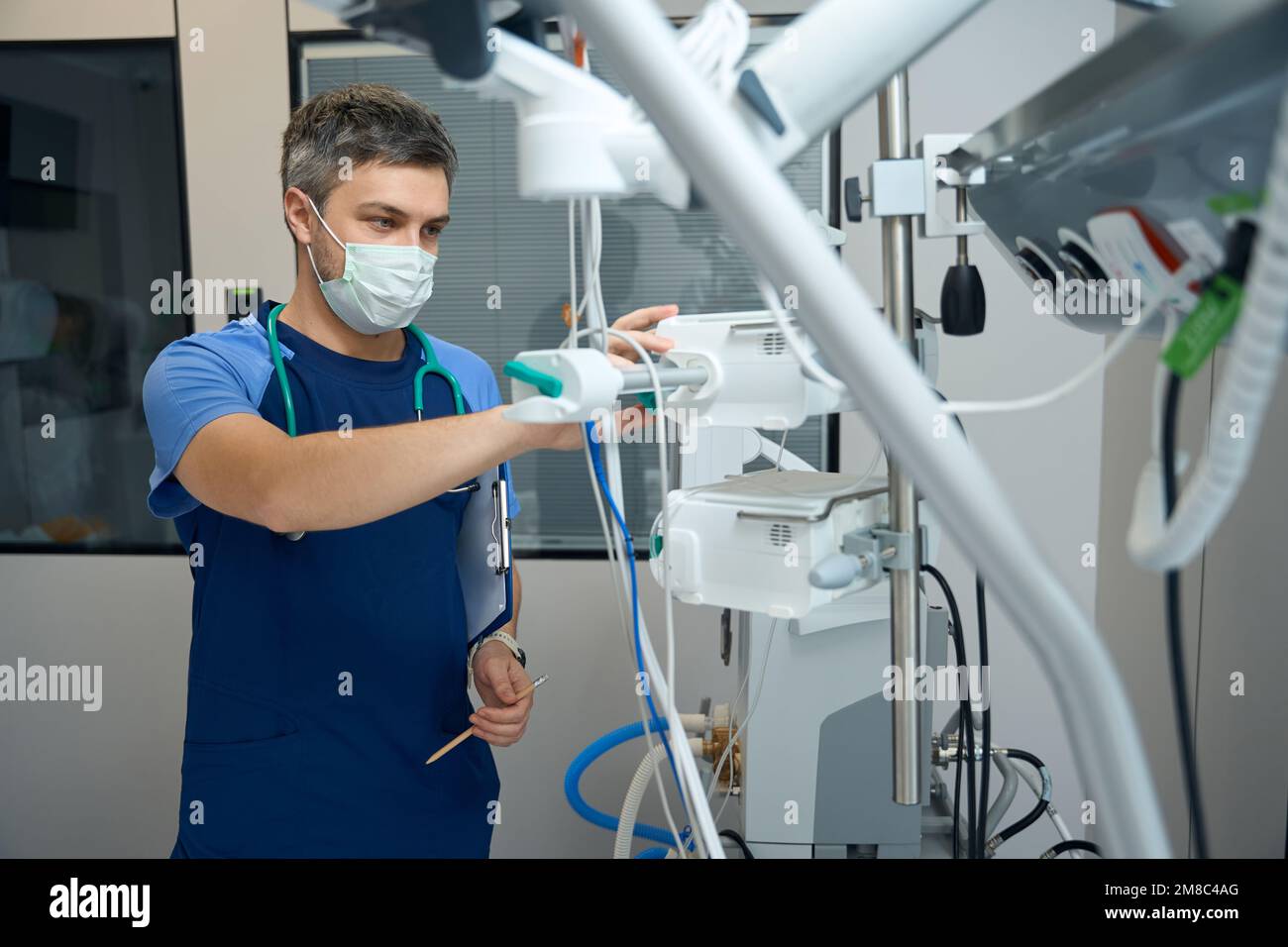 Nurse working in the hospital, checking medical devices Stock Photo - Alamy