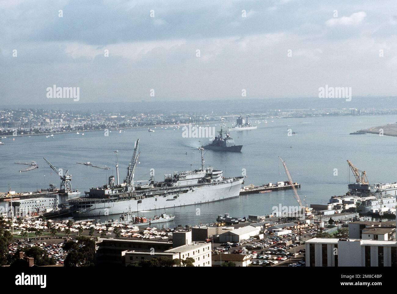 The submarine tender USS DIXON (AS 37) sits at the dock as the guided ...