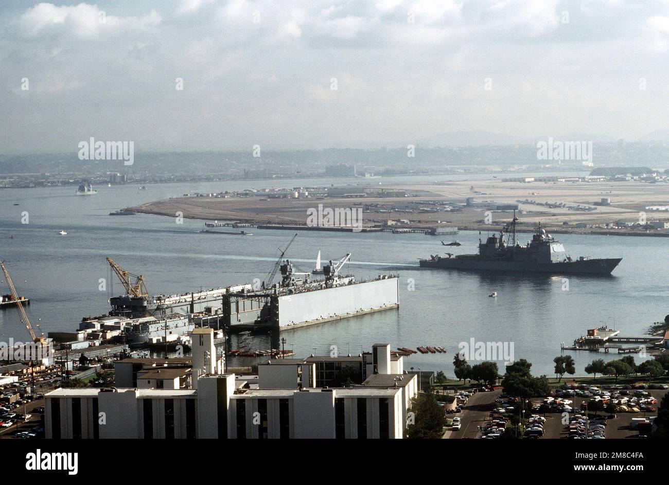 The guided missile cruiser USS VALLEY FORGE (CG 50) steams past the ...