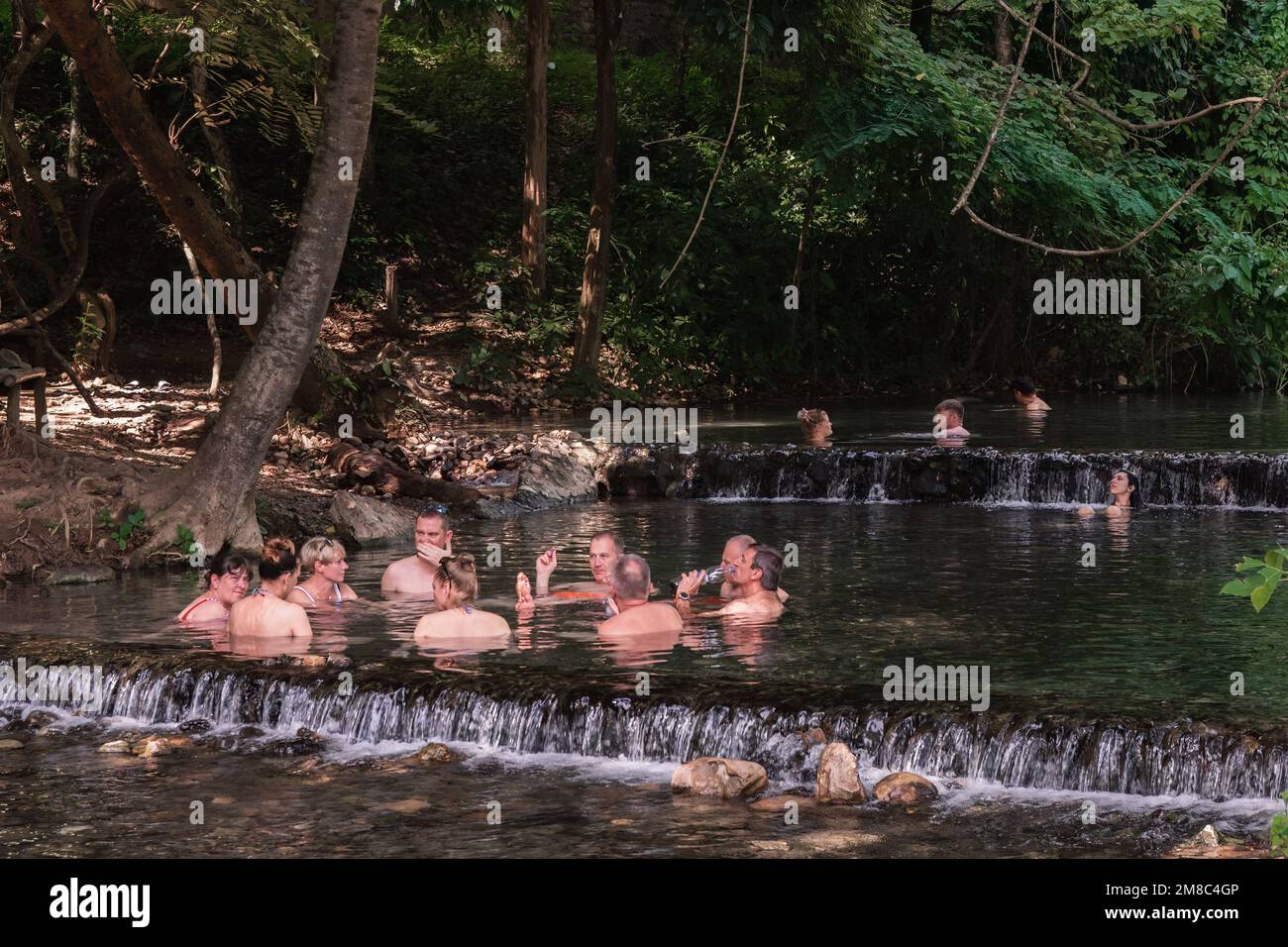 pai, Thailand. November 23, 2022. Tourists bathing in Sai Ngam hot ...