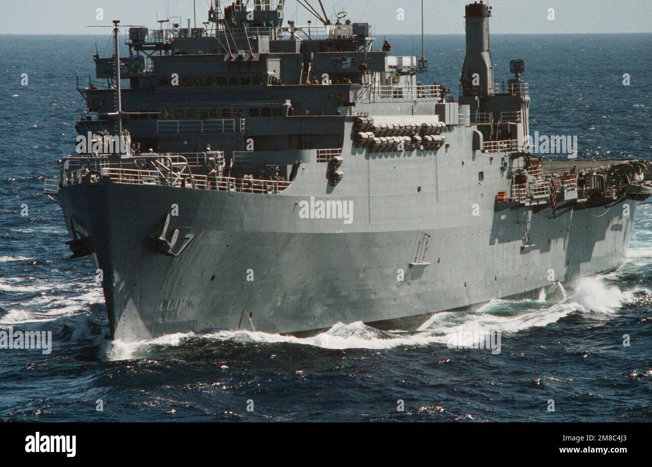 A close-up port bow view of the amphibious transport dock USS CLEVELAND ...