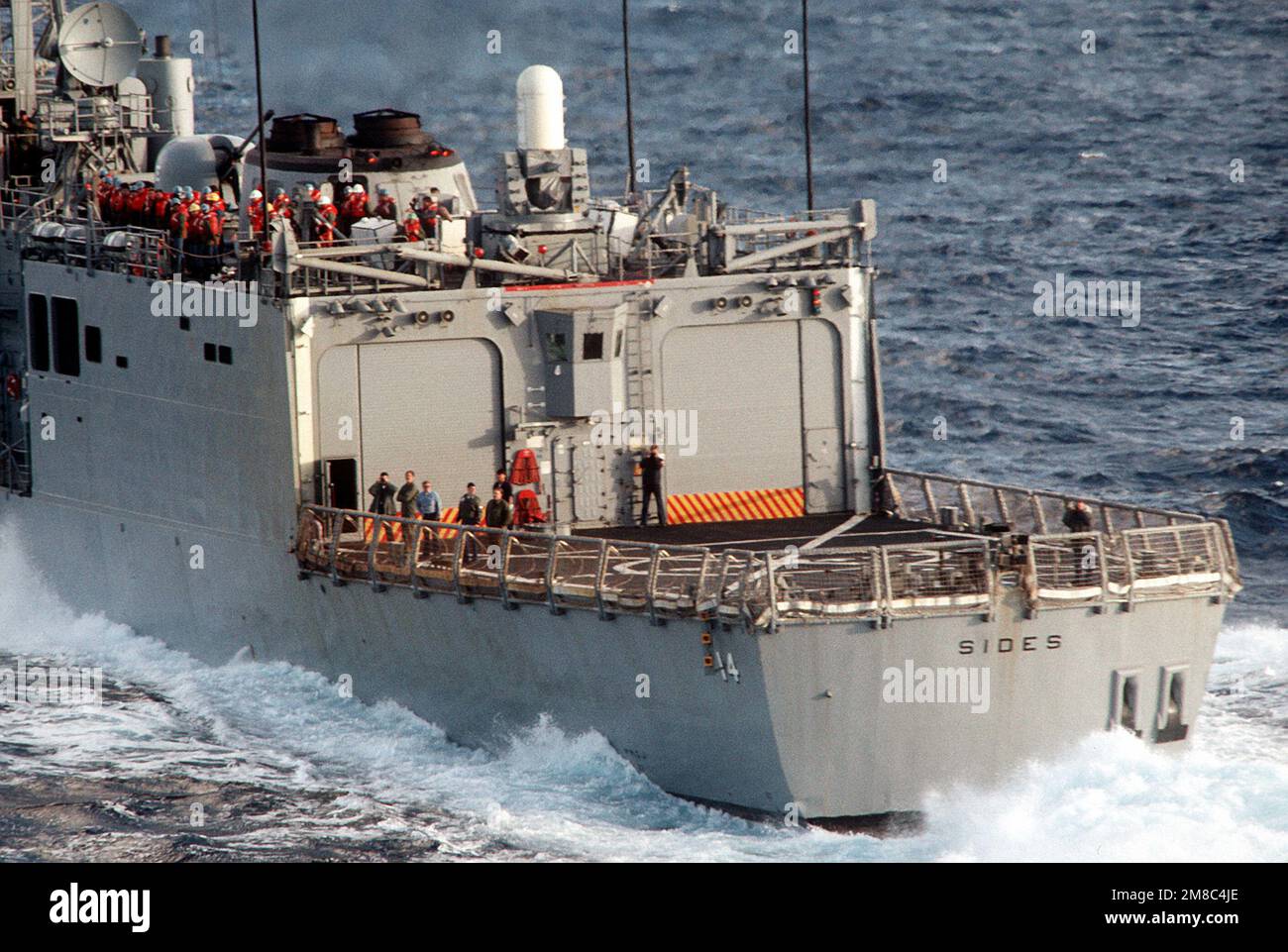 Sailors aboard the guided missile frigate USS JOHN H. SIDES (FFG 14 ...
