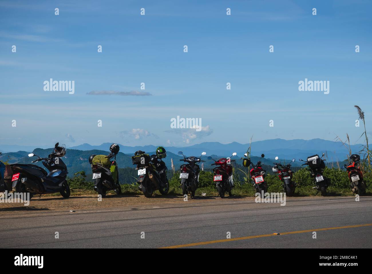 Pai, Thailand. November 23, 2022. Row of motorbikes parked on the side ...