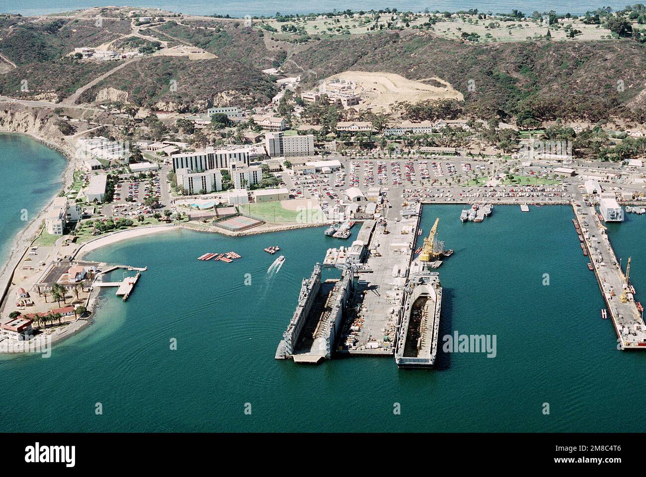 An aerial view of the Point Loma submarine base with two floating dry docks, center, during ...