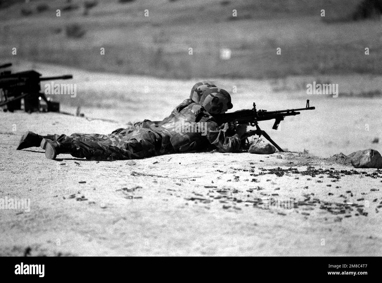 Soldiers fire an M-60E3 machine gun at a National Training Center ...