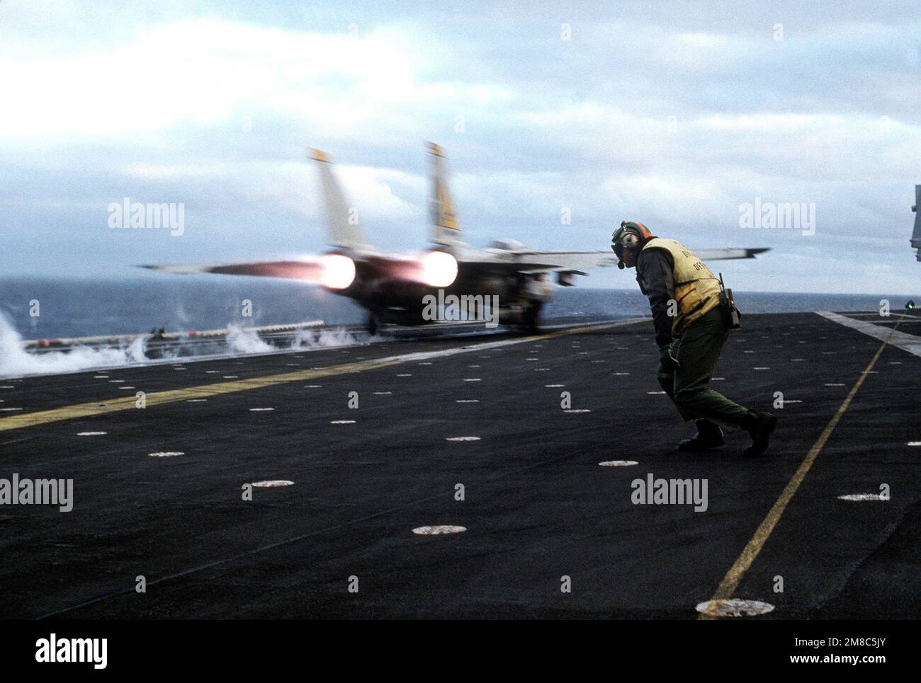 A Fighter Squadron 21 (VF-21) F-14A Tomcat aircraft is launched from ...