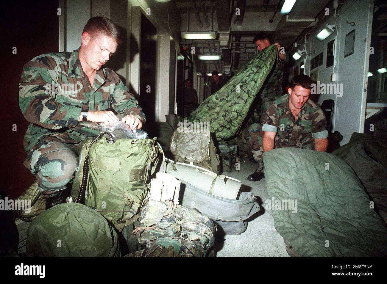 Marines aboard the amphibious assault ship USS PELELIU (LHA-5) prepare ...