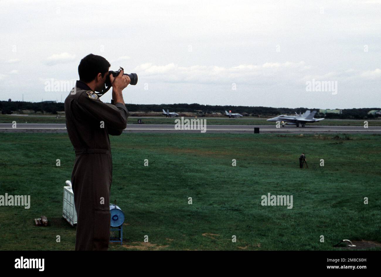 SSGT Theodore J. Koniares uses a Canon still video camera to film the ...