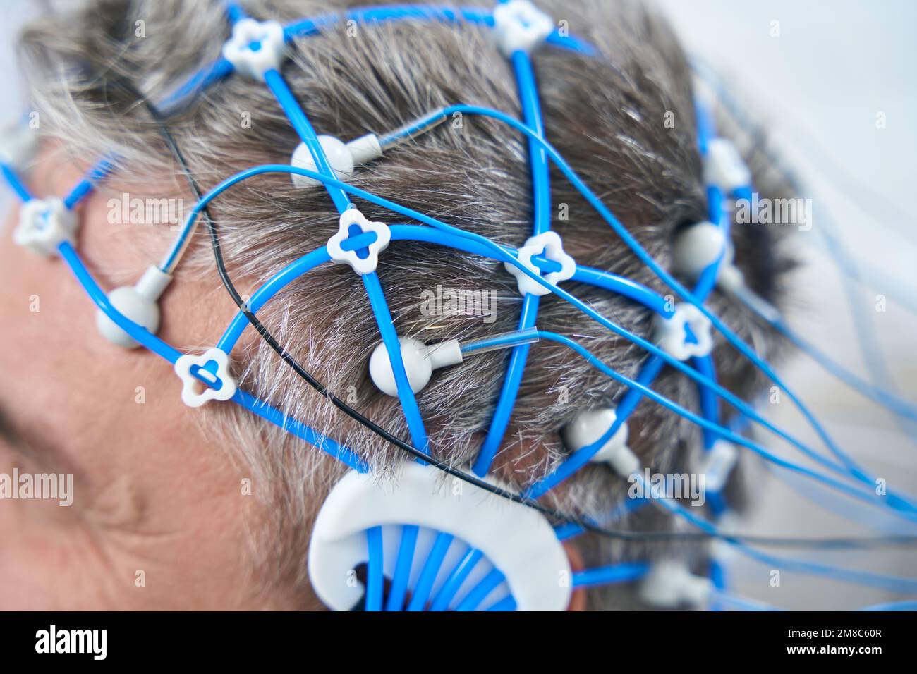 Gray-haired man on the diagnosis of EEG - electroencephalography Stock ...