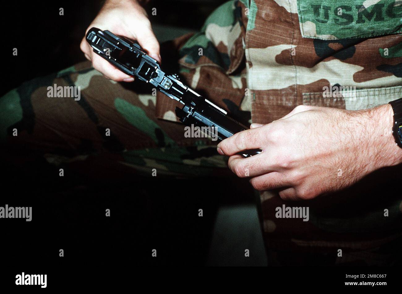 A Marine embarked aboard the amphibious assault ship USS Peleliu (LHA-5 ...