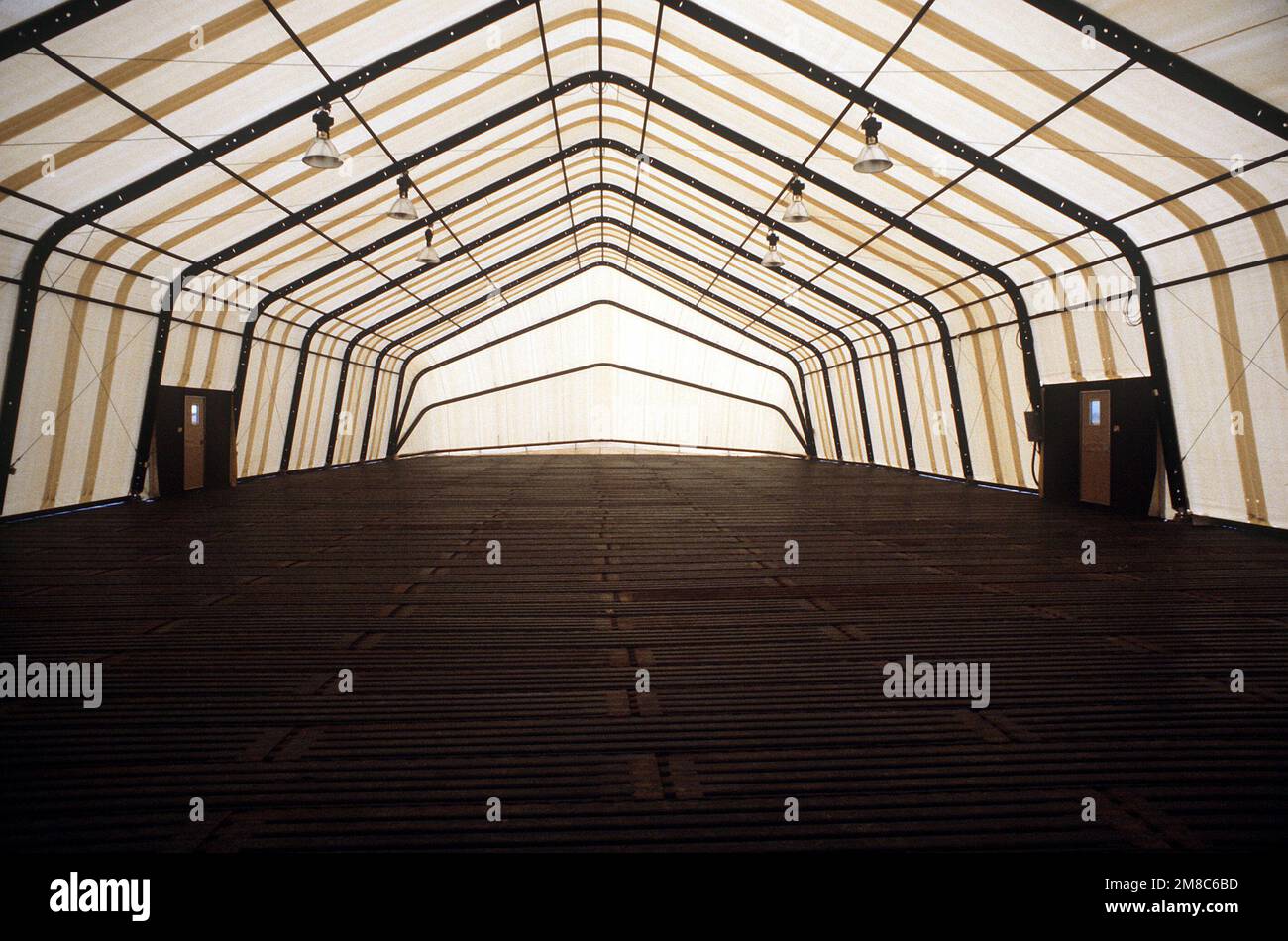 An interior view of a portable hangar being used in PACEX '89. Subject ...