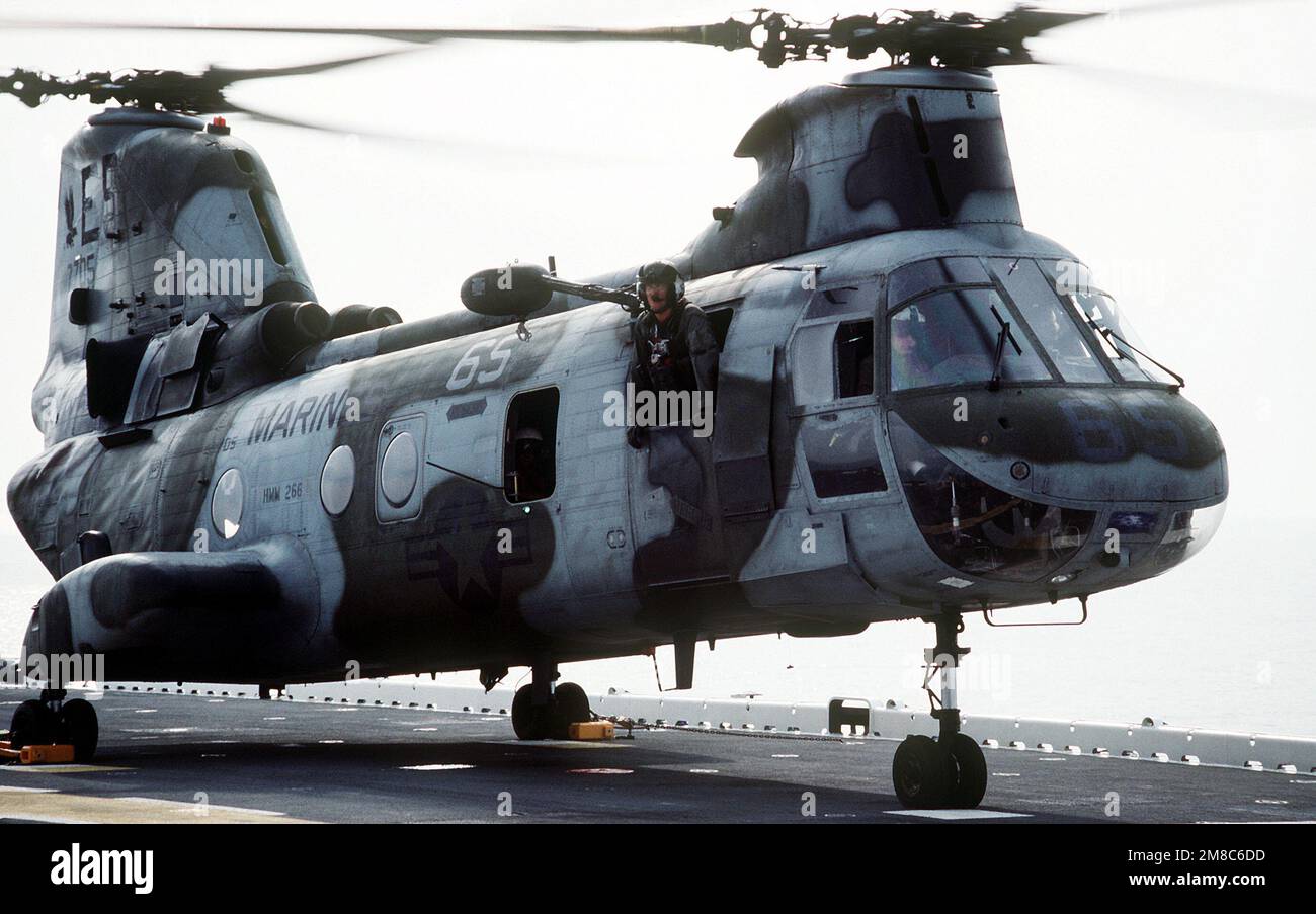 A Marine stands in a doorway of a Marine Medium Helicopter Squadron 266 ...