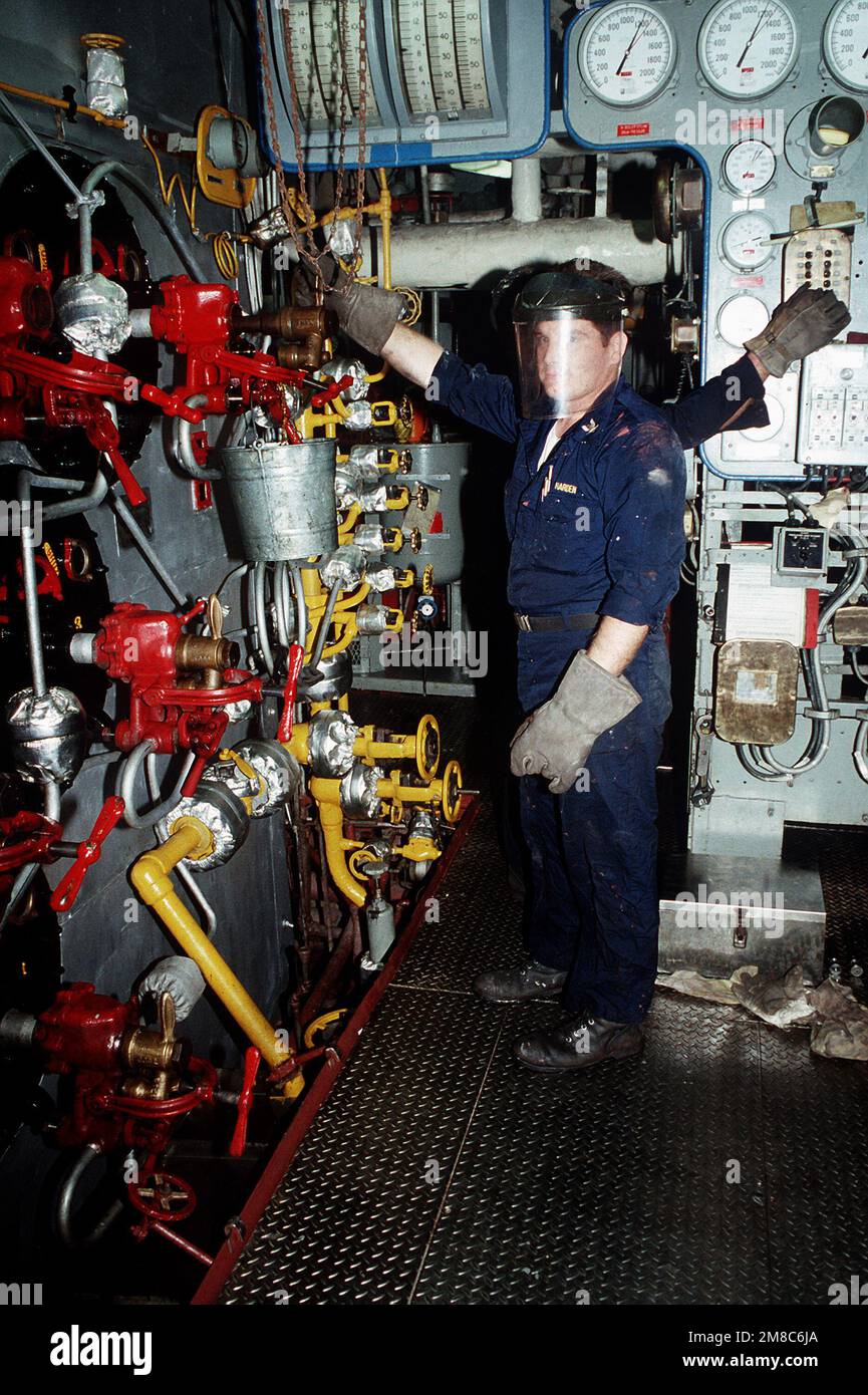 A boiler technician aboard the aircraft carrier USS Constellation (CV ...
