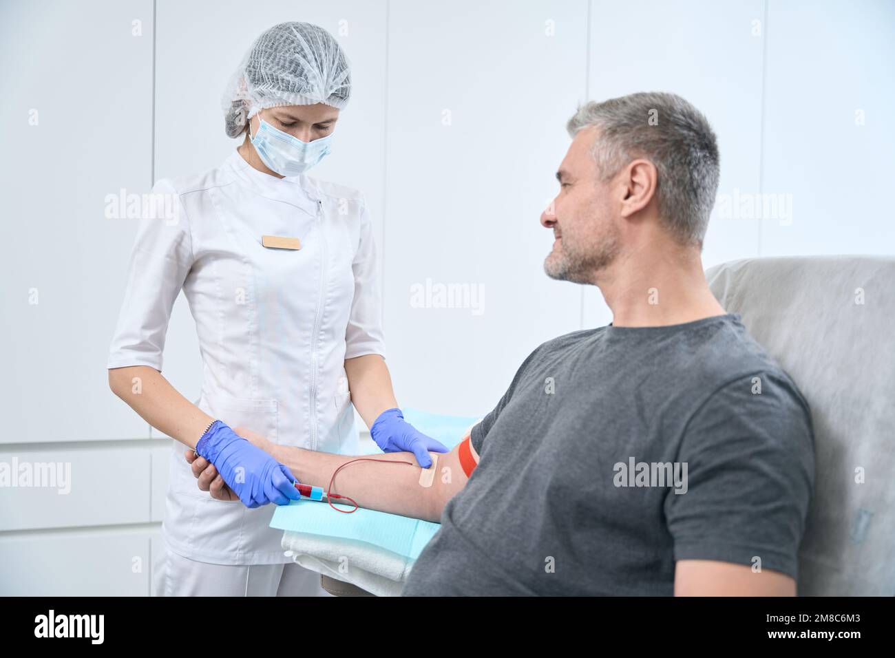 Man taking blood sample from hi-res stock photography and images - Alamy