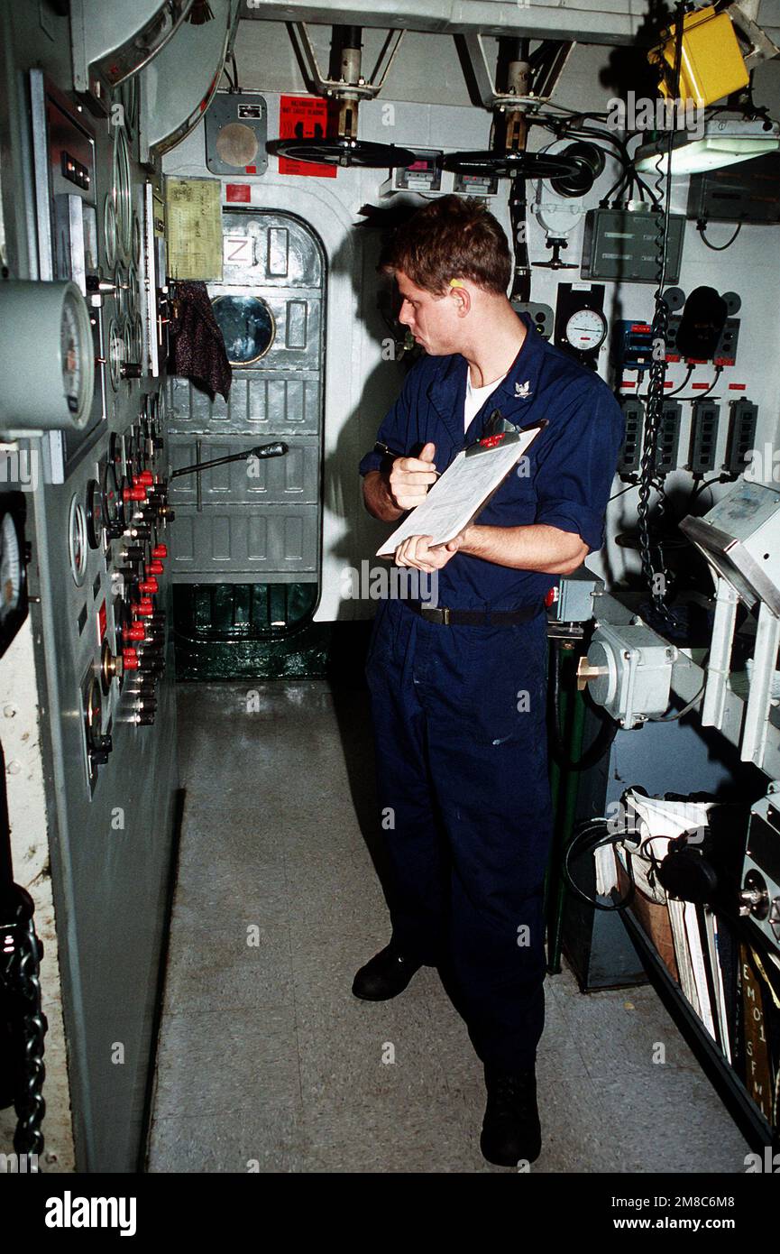 A boiler technician aboard the aircraft carrier USS Constellation (CV ...
