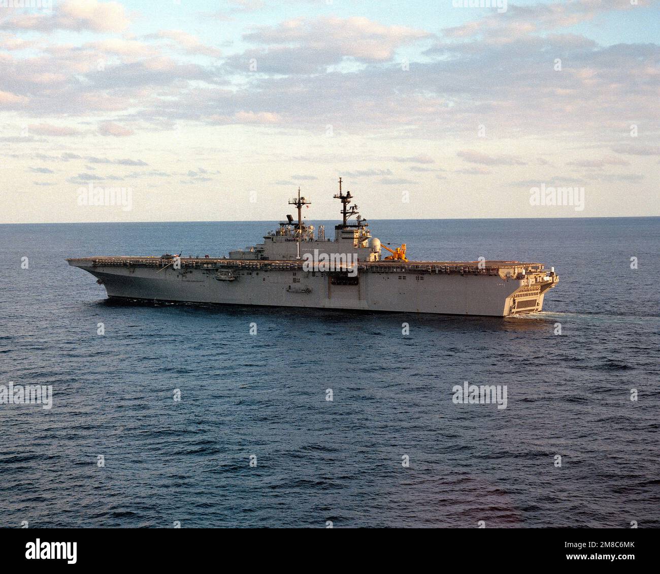 A port view of the amphibious assault ship USS WASP (LHD 1) underway ...