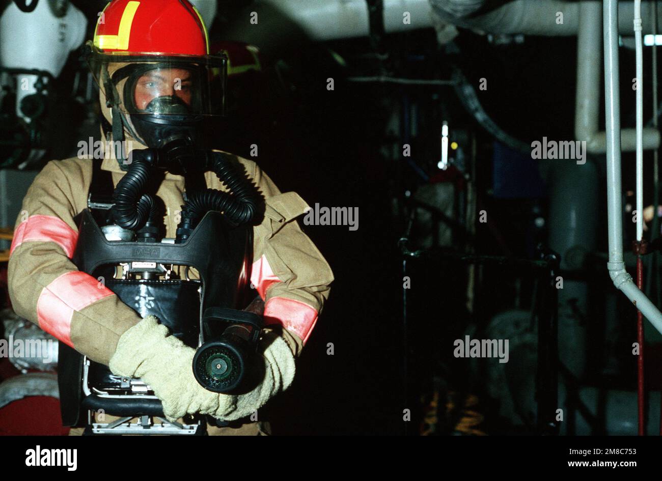 A sailor participates in a shipboard damage control drill during PACEX ...