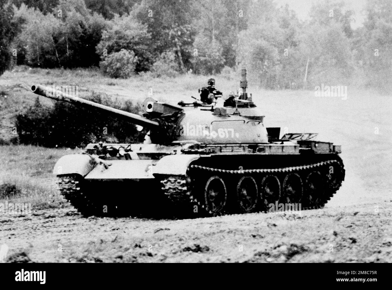 A left front view of a Soviet T-55 main battle tank. Country: Unknown ...