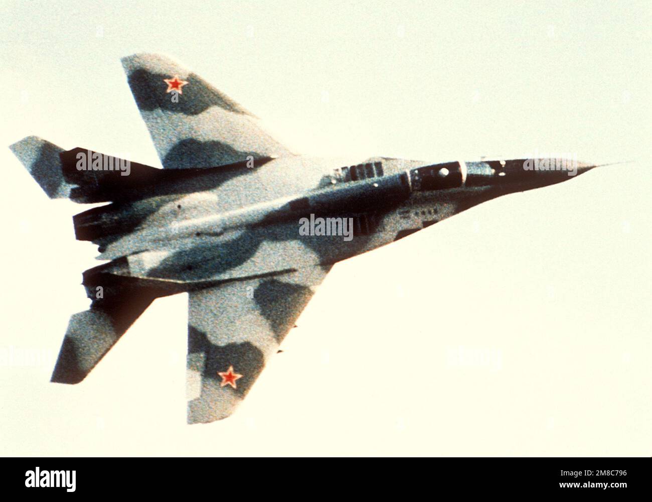 An air-to-air top left view of a Soviet MiG-29 Fulcrum aircraft ...