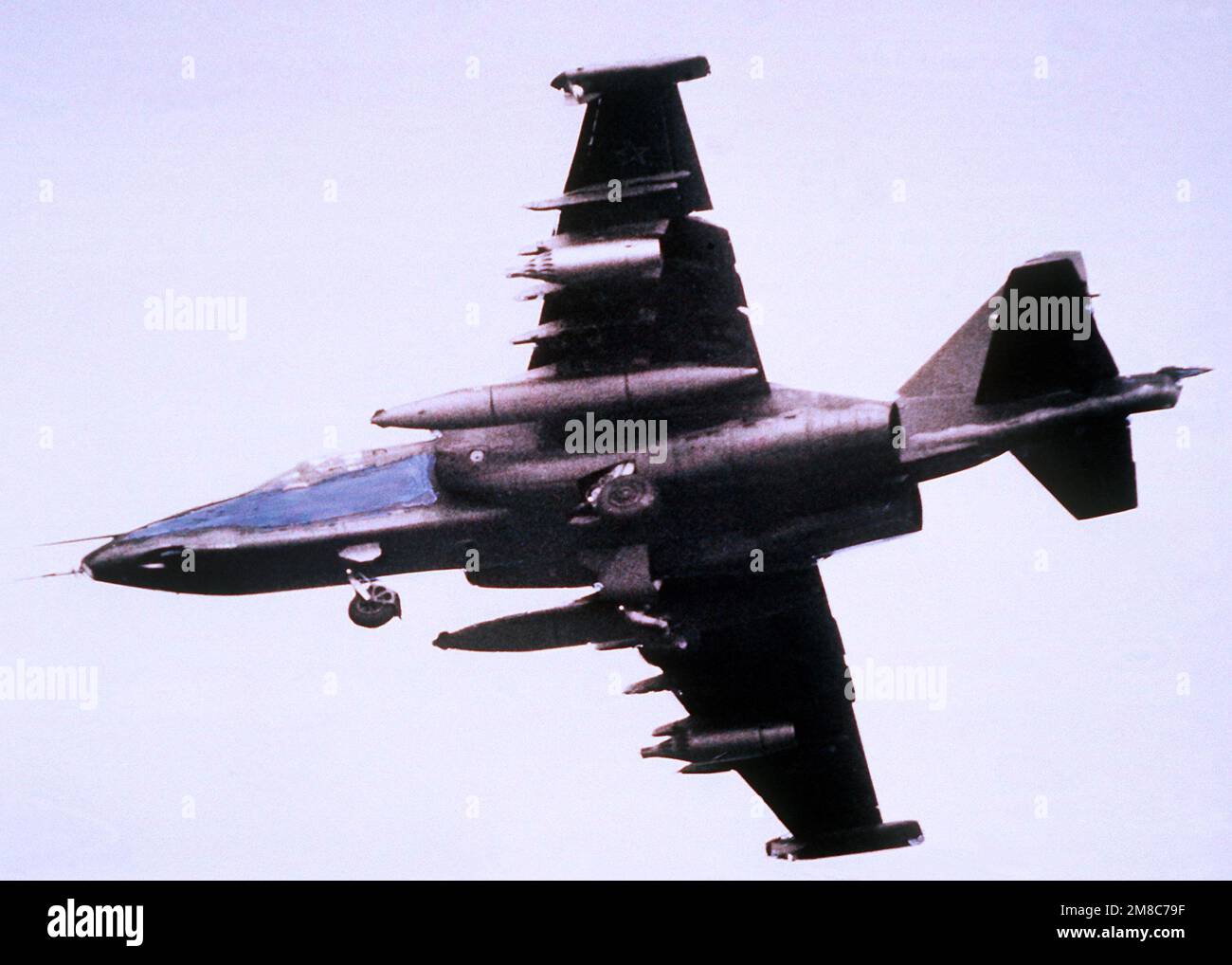 A left underside view of a Soviet Su-25 Frogfoot aircraft in-flight ...
