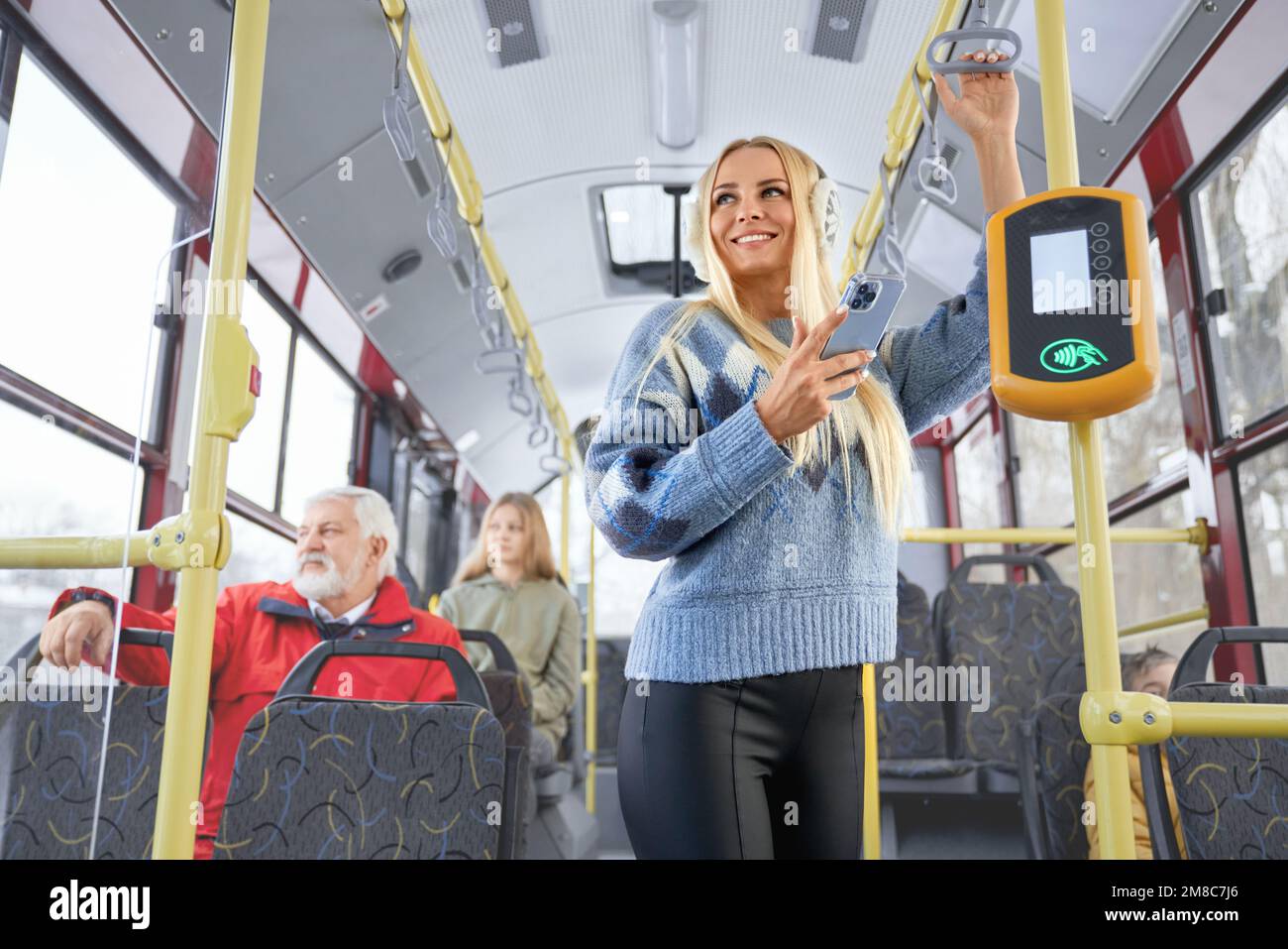 Portrait of pretty blondie female passing through city going to job ...