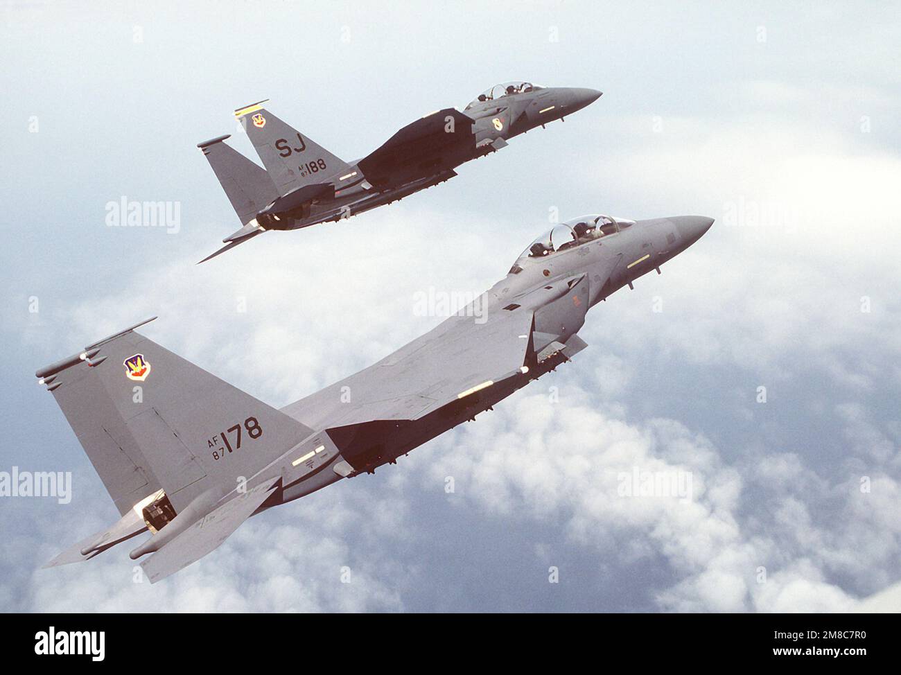 An air-to-air right side view of two F-15E Eagle aircraft of the 4th ...