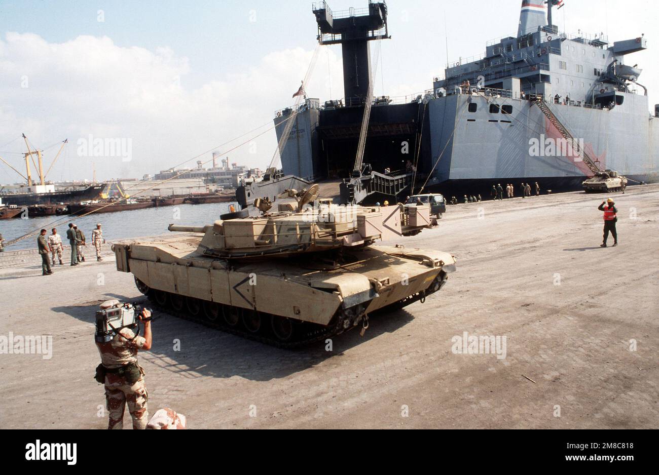A combat cameraman films an M-1 Abrams main battle tank after its ...