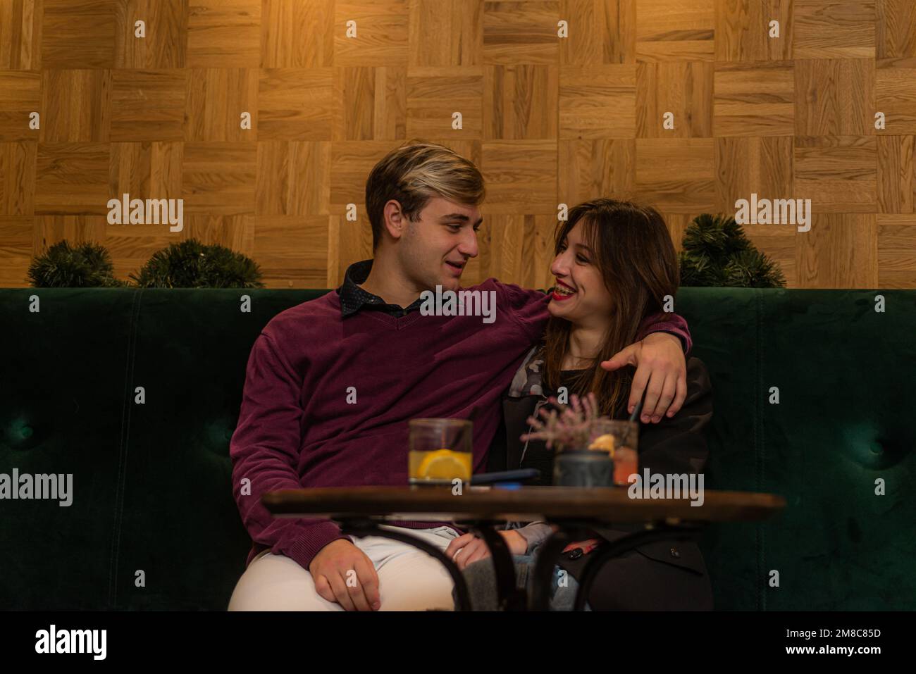 Amazing and adorable couple is hugging and smiling Stock Photo - Alamy