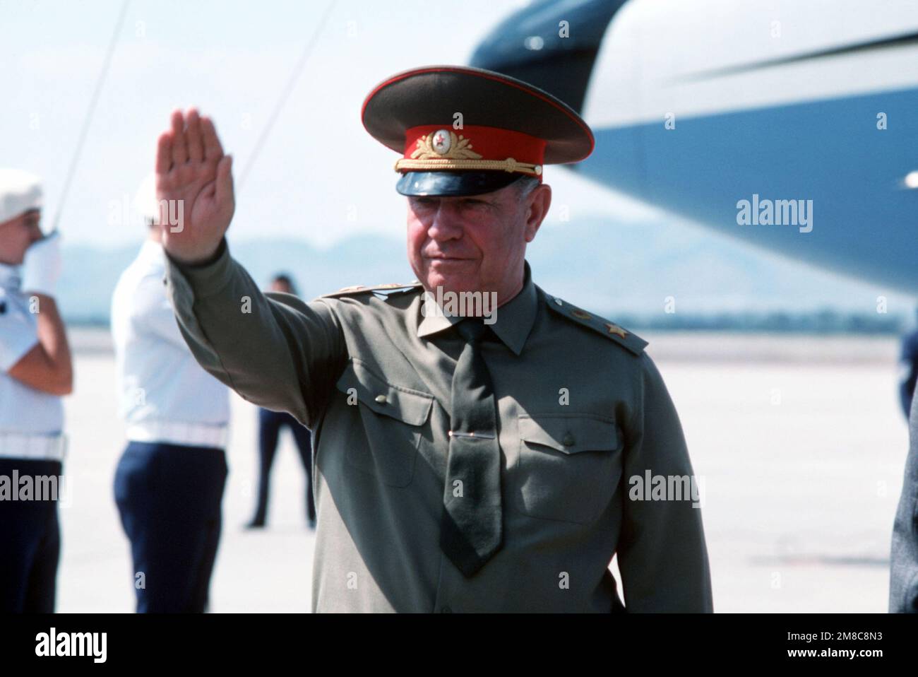 Soviet Defense Minister General Dmitriy T. Yazov, waves after bidding ...